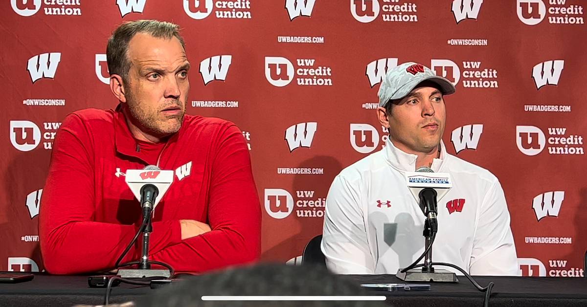 UW Athletic Director Chris McIntosh and interim coach Jim Leonhard ...