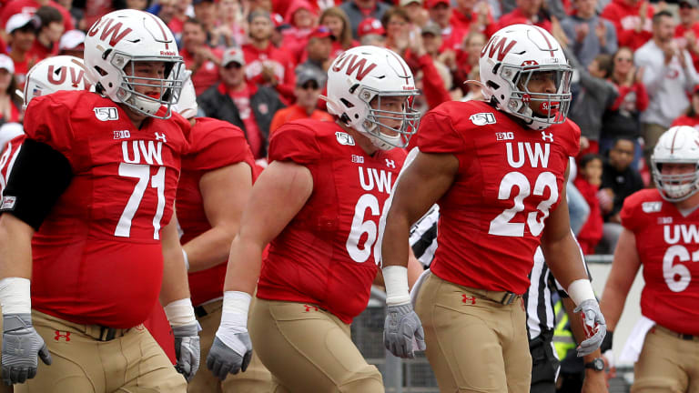 Wisconsin players mirror Target employees in throwback uniforms ...