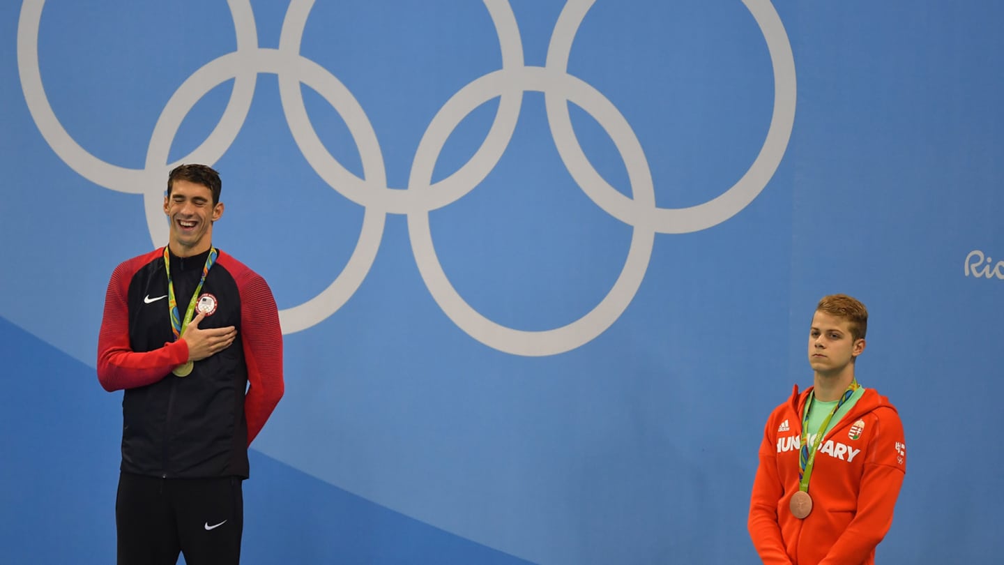 Michael Phelps explains laughing during National Anthem - Sports ...