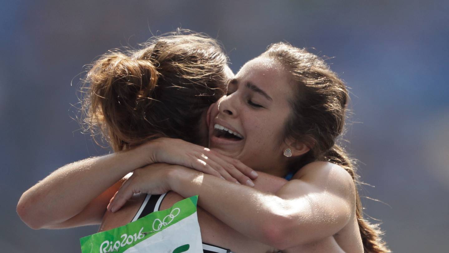 Runners help each other after fall, lifting Olympic spirit - Sports ...