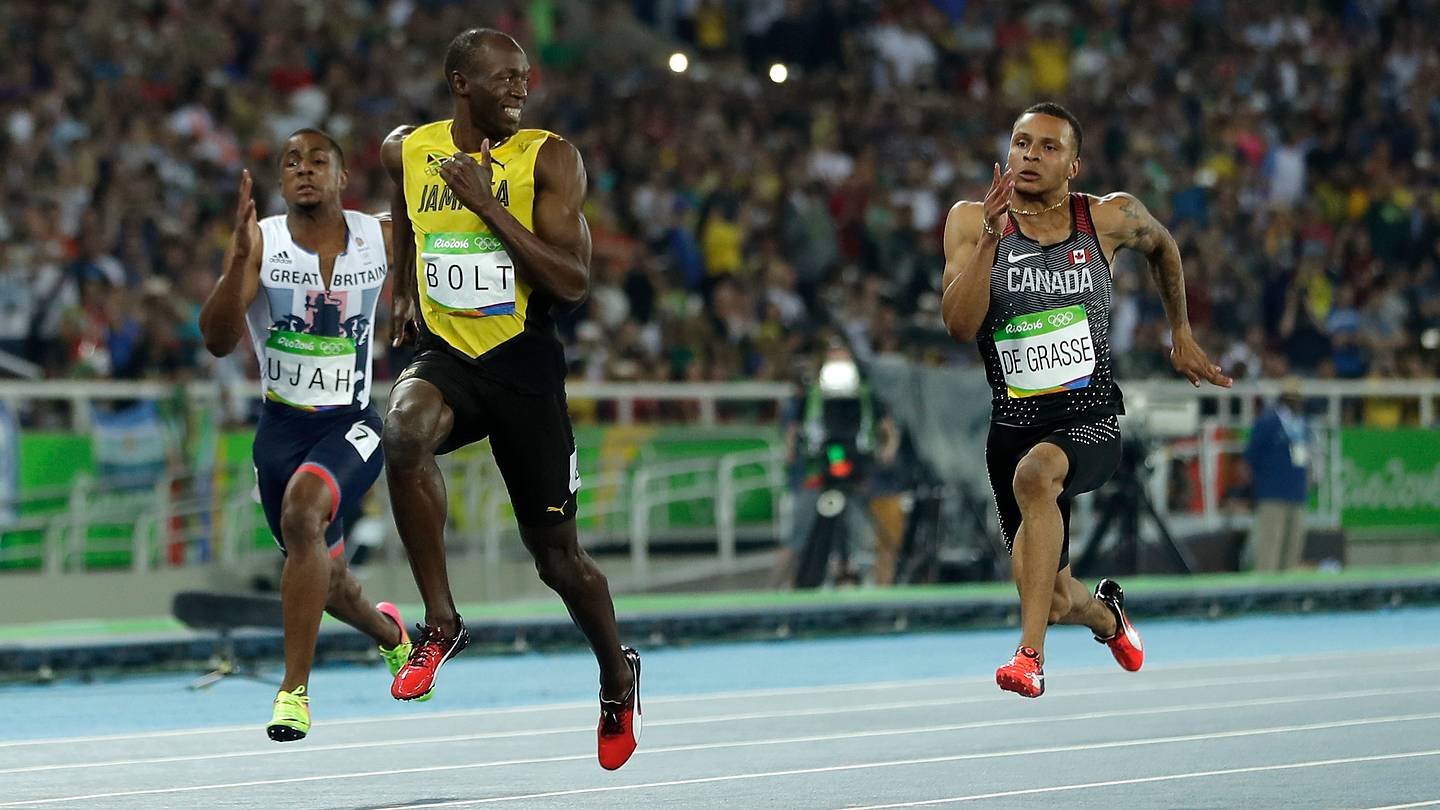 Usain Bolt smiles while running 100 meters (photos) - Sports Illustrated