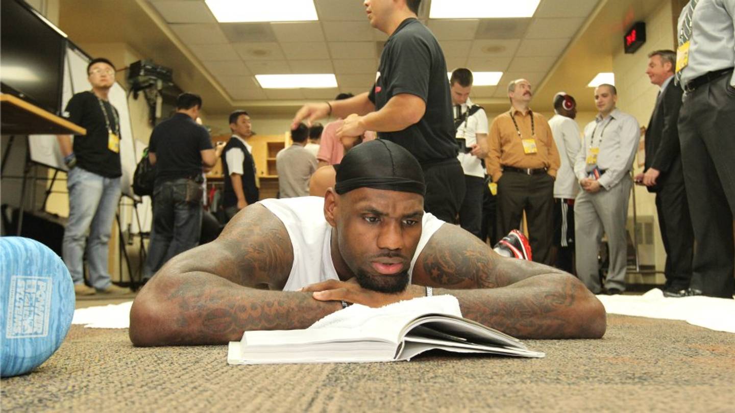 Cleveland Cavaliers' LeBron James reading Divergent - Sports Illustrated