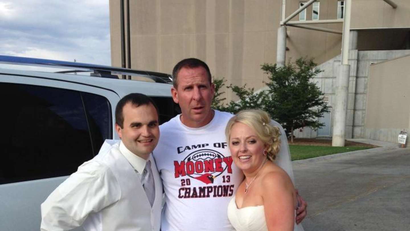 Newlyweds pose with Nebraska coach Bo Pelini - Sports Illustrated