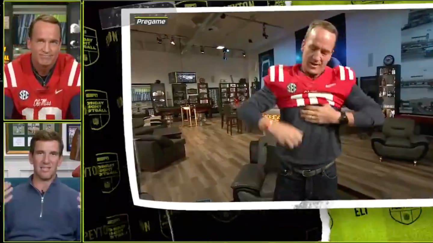 Manning Cast: Peyton wears Eli's Ole Miss jersey after losing bet ...