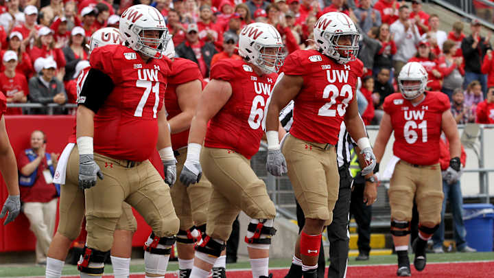 Wisconsin players mirror Target employees in throwback uniforms ...