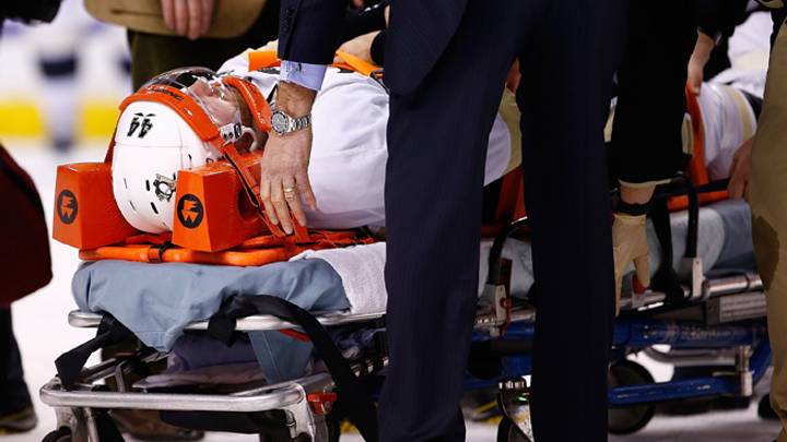 Penguins' defenseman Brooks Orpik leaves ice on a stretcher