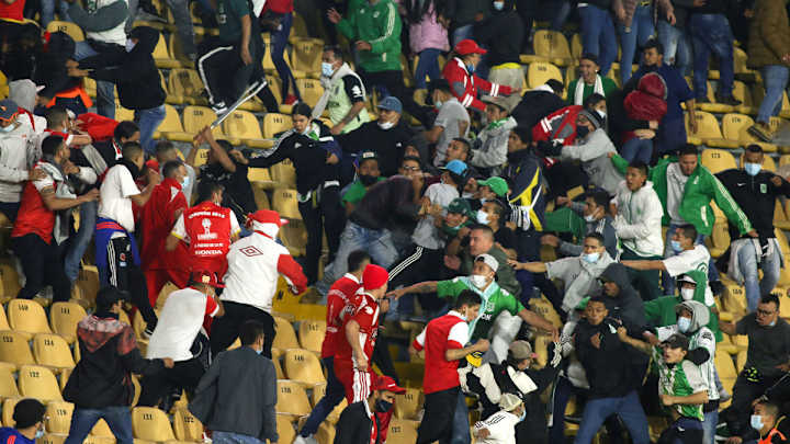 Colombian fans brawl on field at Santa Fe vs Atletico Nacional - Sports ...