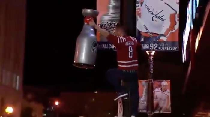 Capitals fans climb street poles to celebrate Stanley Cup win - Sports ...