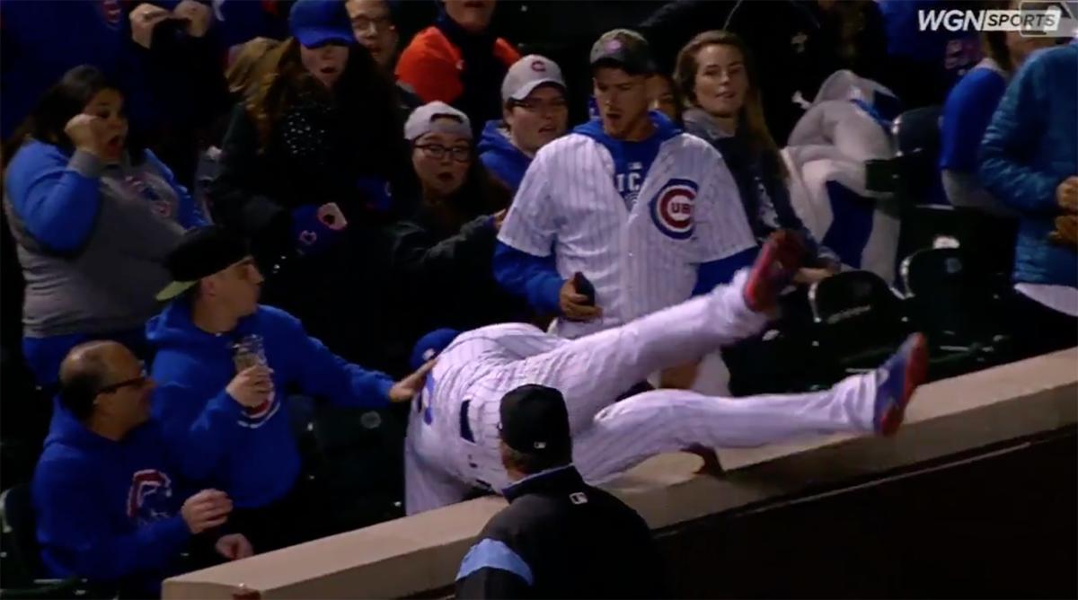 Javy Baez diving catch: Cubs 2B jumps into Wrigley stands - Sports ...