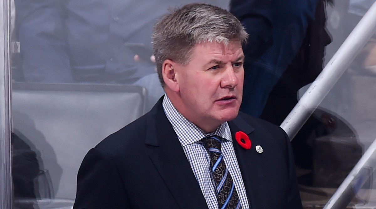 Calgary Flames coach Bill Peters hit in face by puck, needed stitches ...