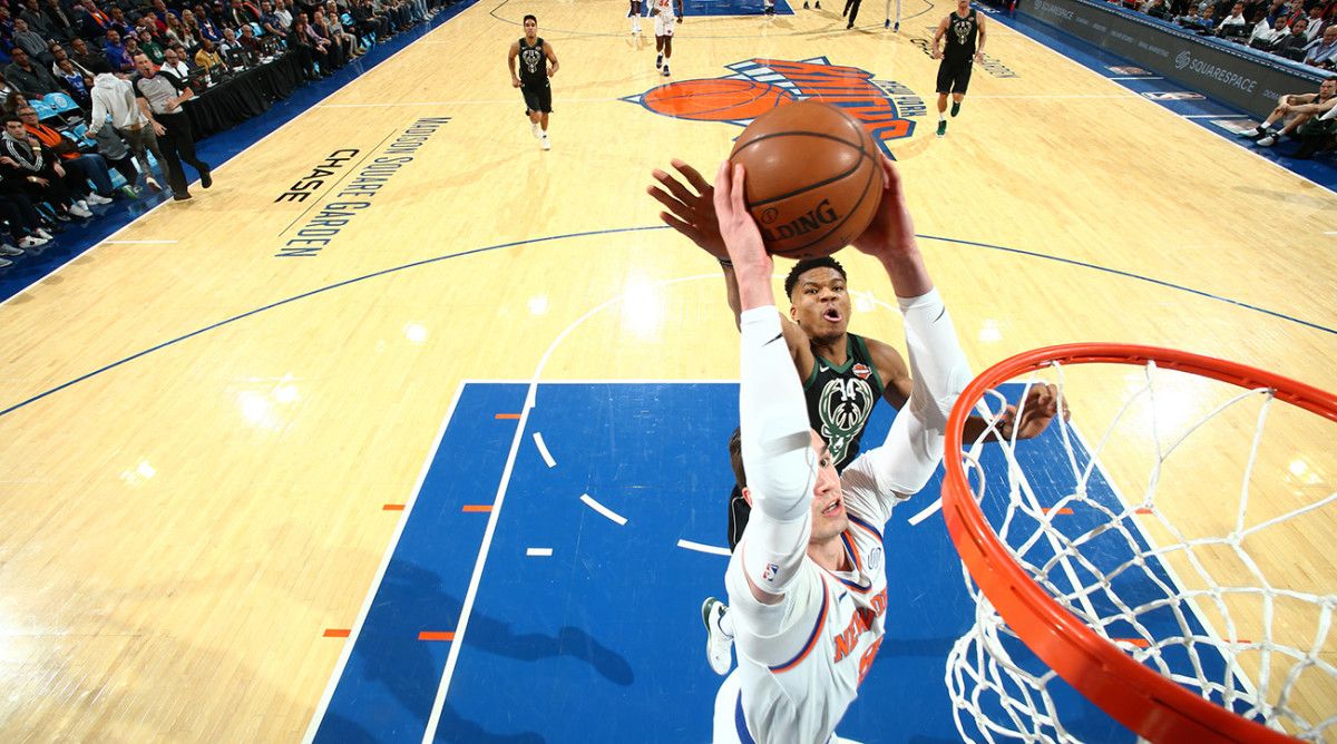 Knicks Mario Hezonja steps over Giannis Antetekuompo after dunk ...