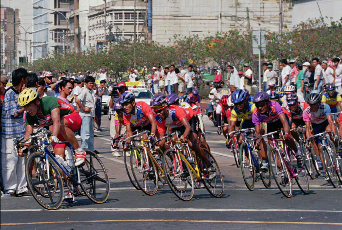 Cyclists forced to ride into oncoming traffic as parked cars block ...