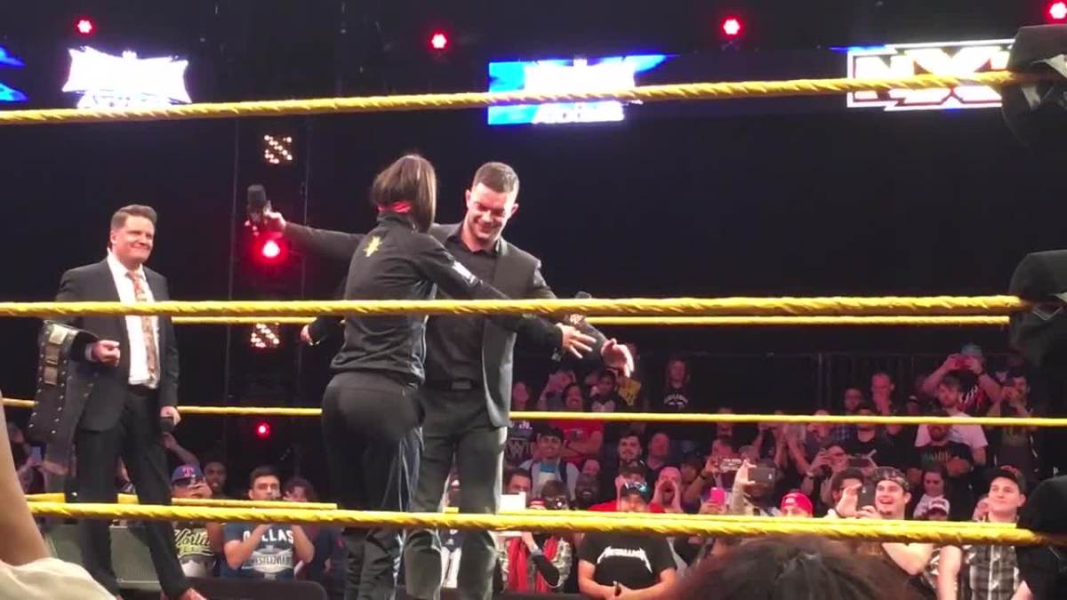 Finn Balor and Bayley hug at WWE AXXESS event - Sports Illustrated