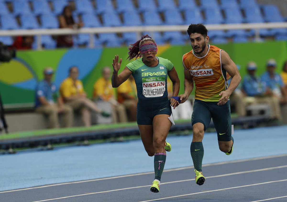 Guides for blind athletes share the struggle - Sports Illustrated