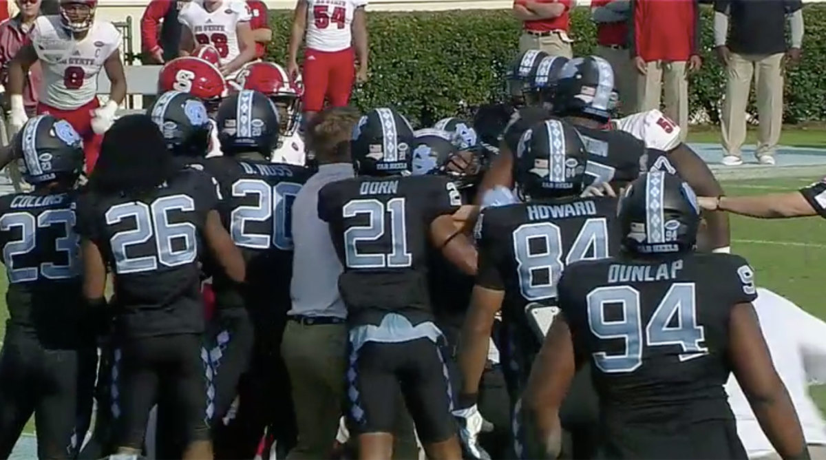 UNC, NC State fight after weird fumble (video) - Sports Illustrated