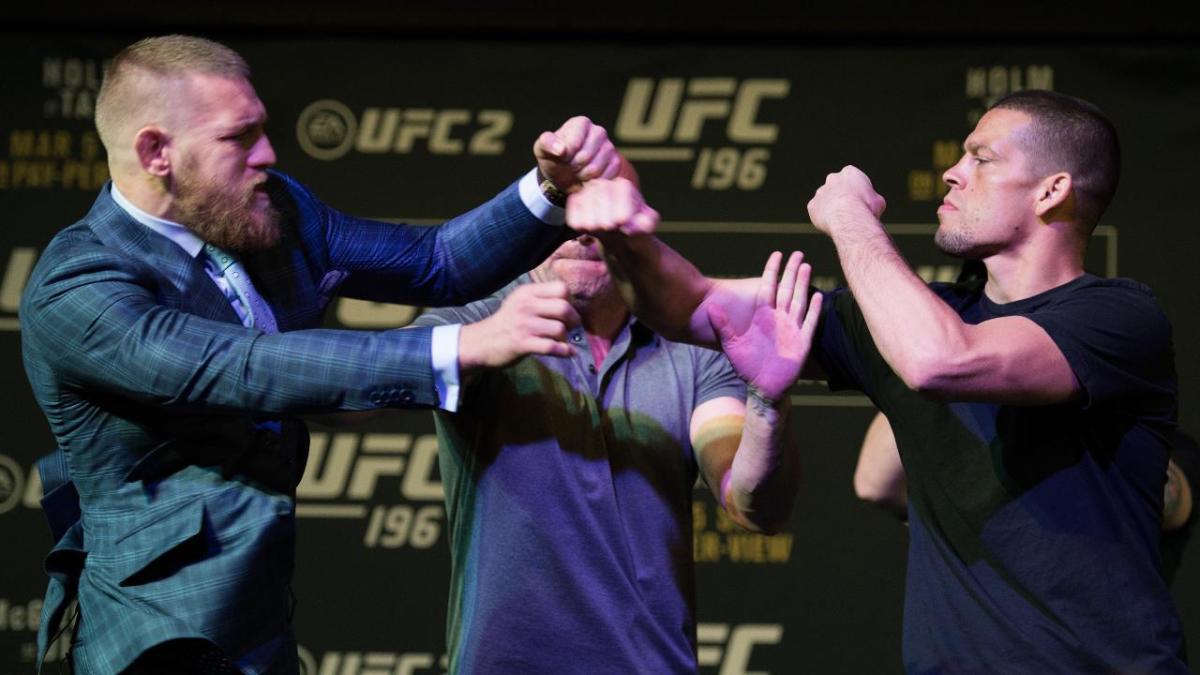 Conor McGregor, Nate Diaz scuffle at UFC 196 press conference - Sports ...