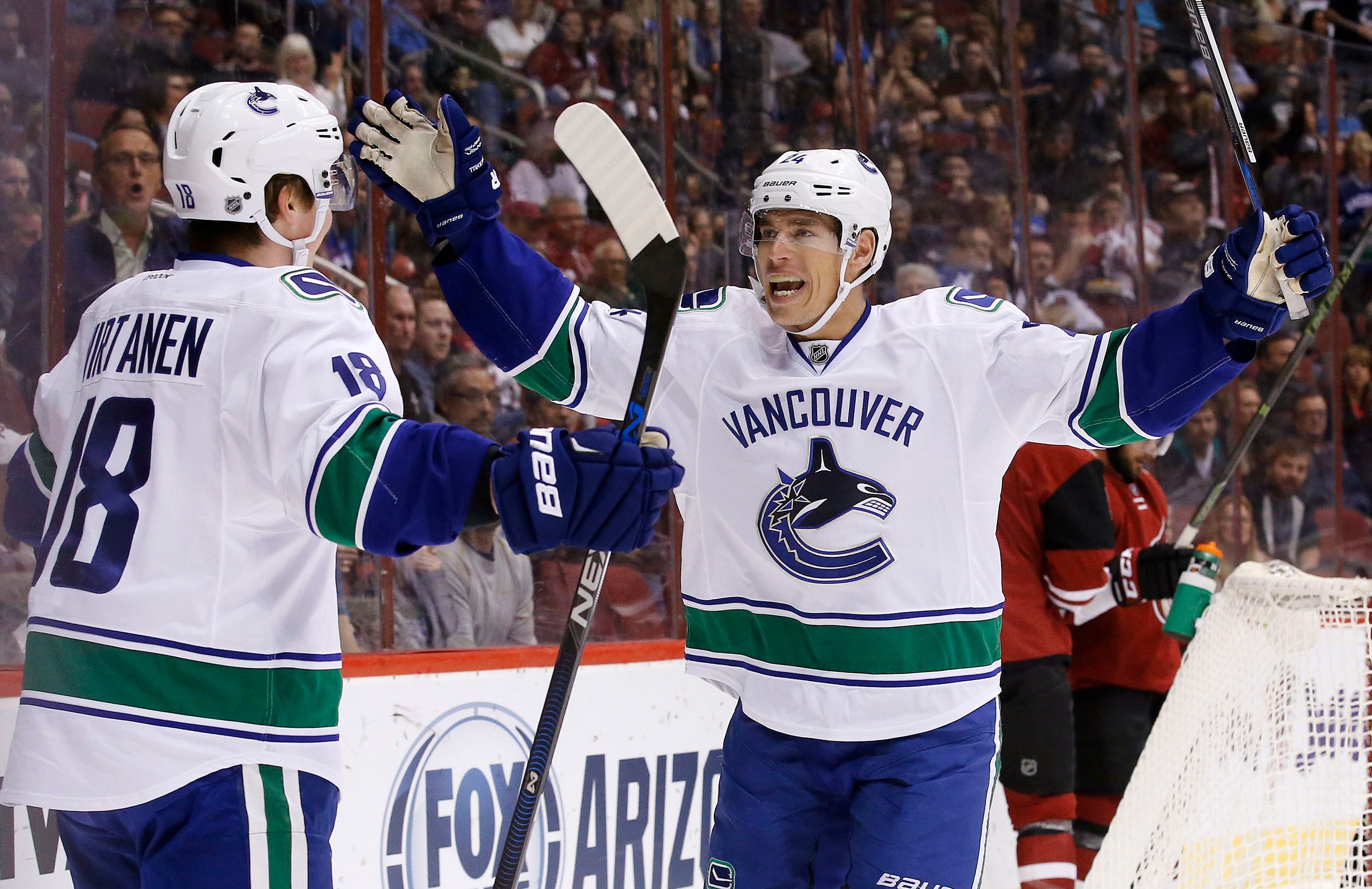 Miller stops 33 shots, Canucks hold off Coyotes 2-1 - Sports Illustrated