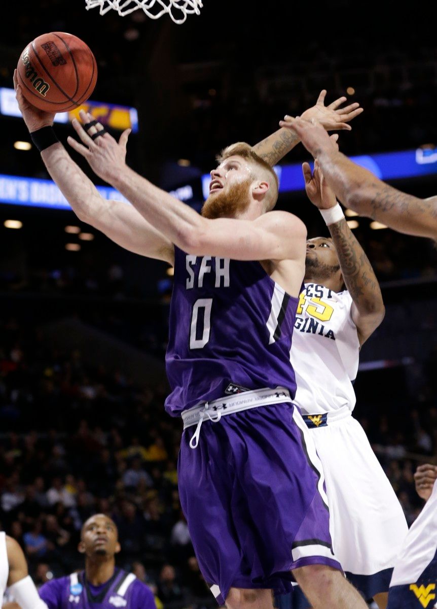 Walkup, No. 14 Stephen F. Austin upset West Virginia 70-56 - Sports ...