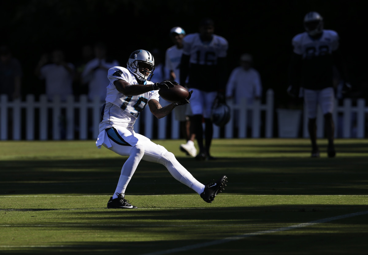 Ginn done 'chasing a check,' happy to return to Panthers - Sports ...