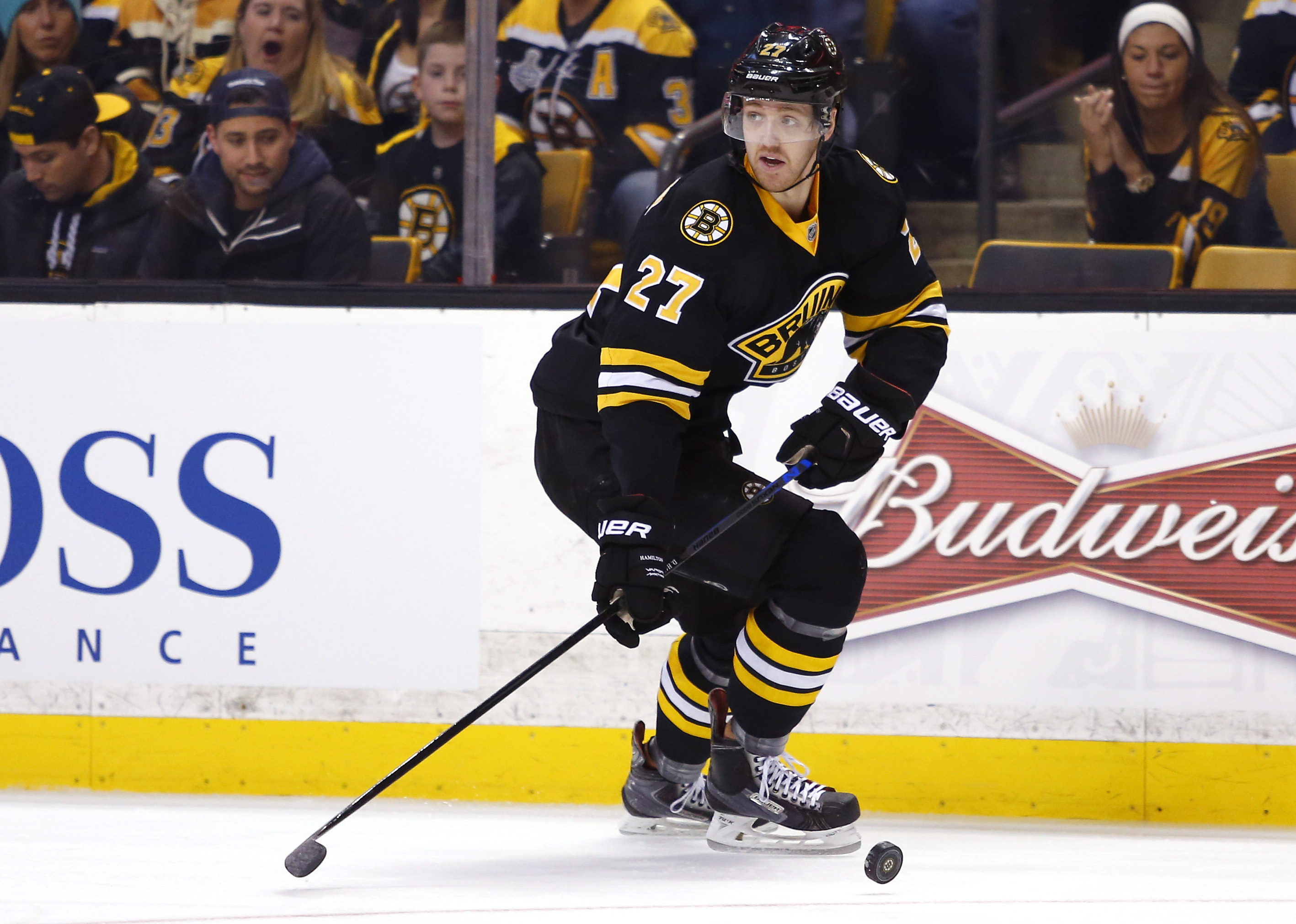 Bruins trade defenseman Hamilton to Flames for 3 draft picks - Sports ...