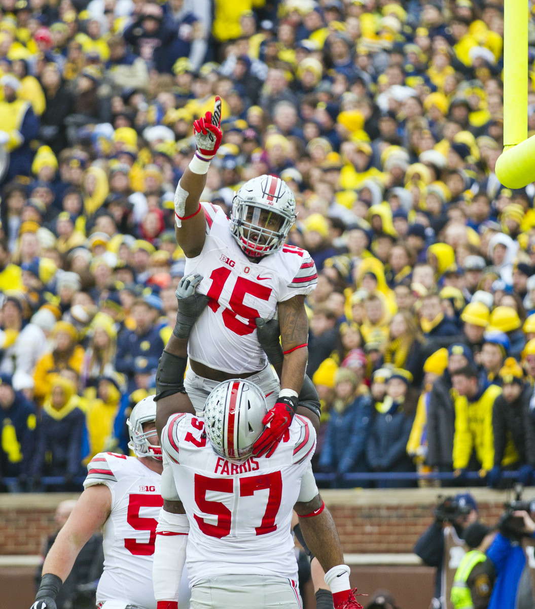 Buckeyes beat Michigan 42-13, but lose spot in title game - Sports ...