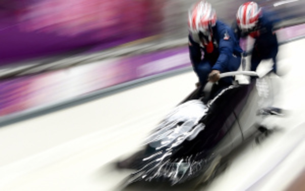 Olympic worker struck by bobsled breaks both legs, may have concussion ...