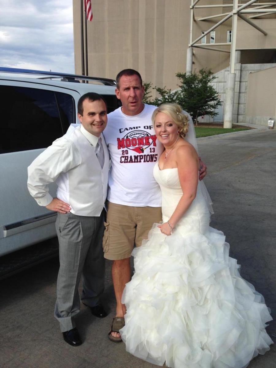Newlyweds pose with Nebraska coach Bo Pelini - Sports Illustrated