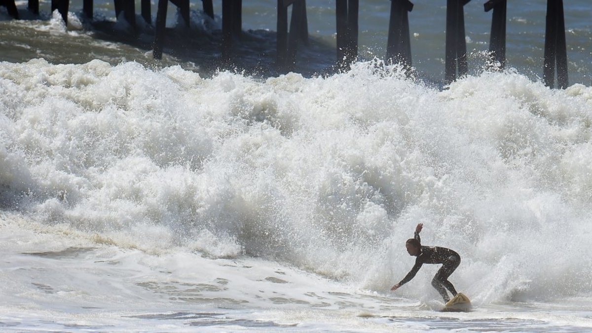 Photos of surfers taking on enormous waves created by Hurricane Marie ...