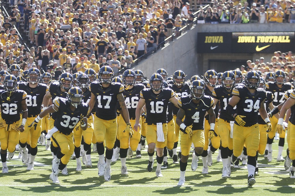 Iowa fan sells turkey legs at Hawkeye tailgate - Sports Illustrated