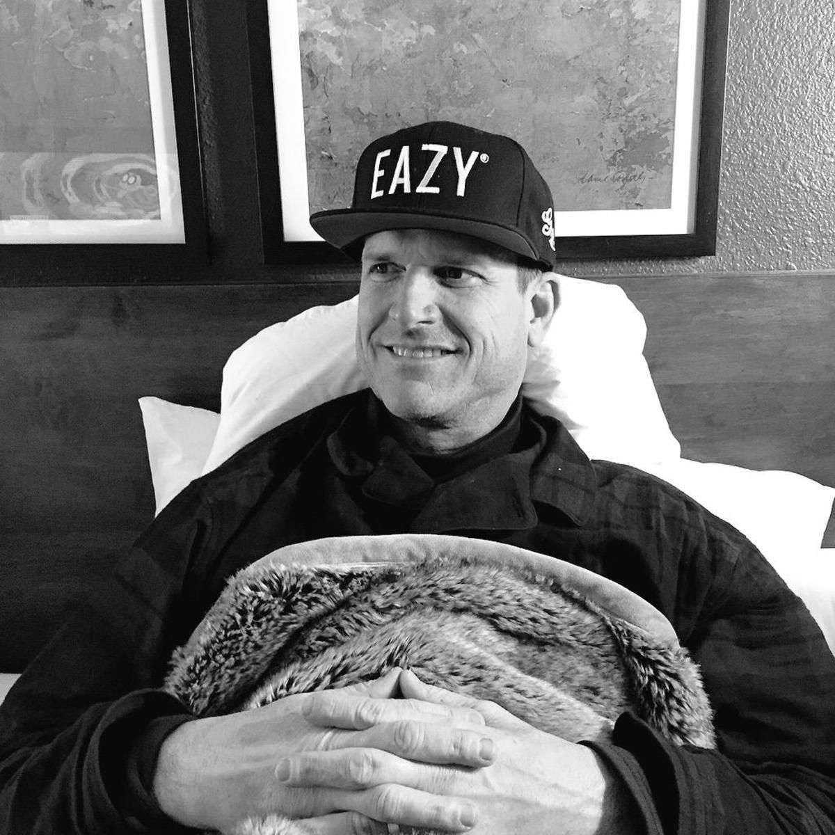 Michigan Wolverines football coach Jim Harbaugh wears G-Eazy hat ...