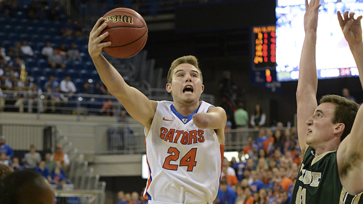 One-handed Florida freshman Zach Hodskins plays on opening night ...