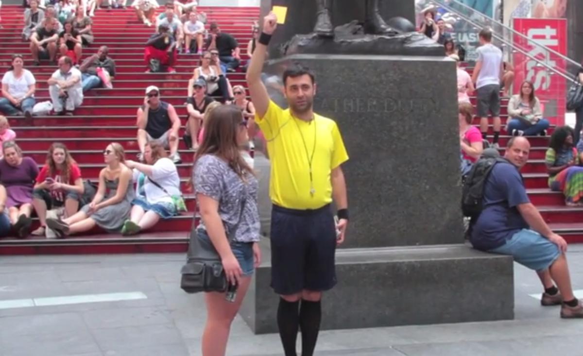 A guy dressed as a referee walked the streets of New York giving people ...