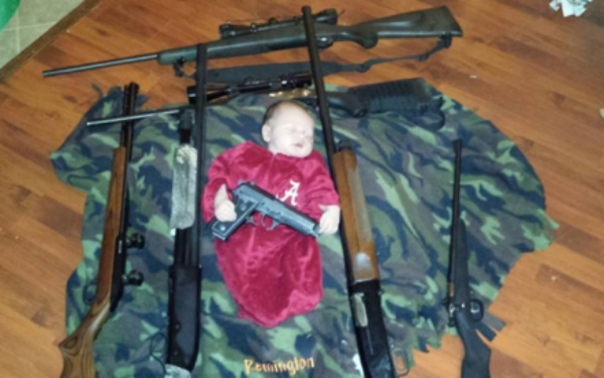 Alabama Fan Puts Baby in Crimson Tide Onesie, Surrounds Baby with Guns ...