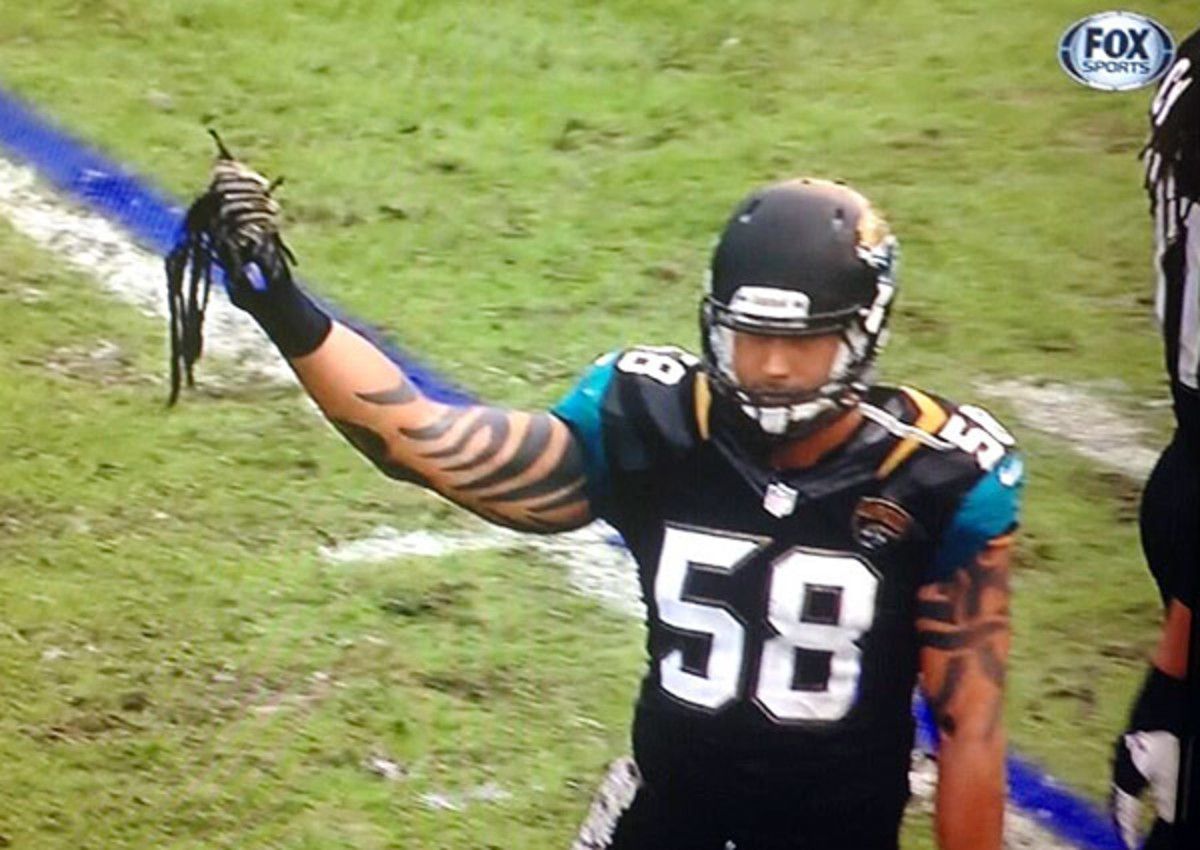 Jason Babin rips dreads from Andre Ellington's head during Jags-Cards ...