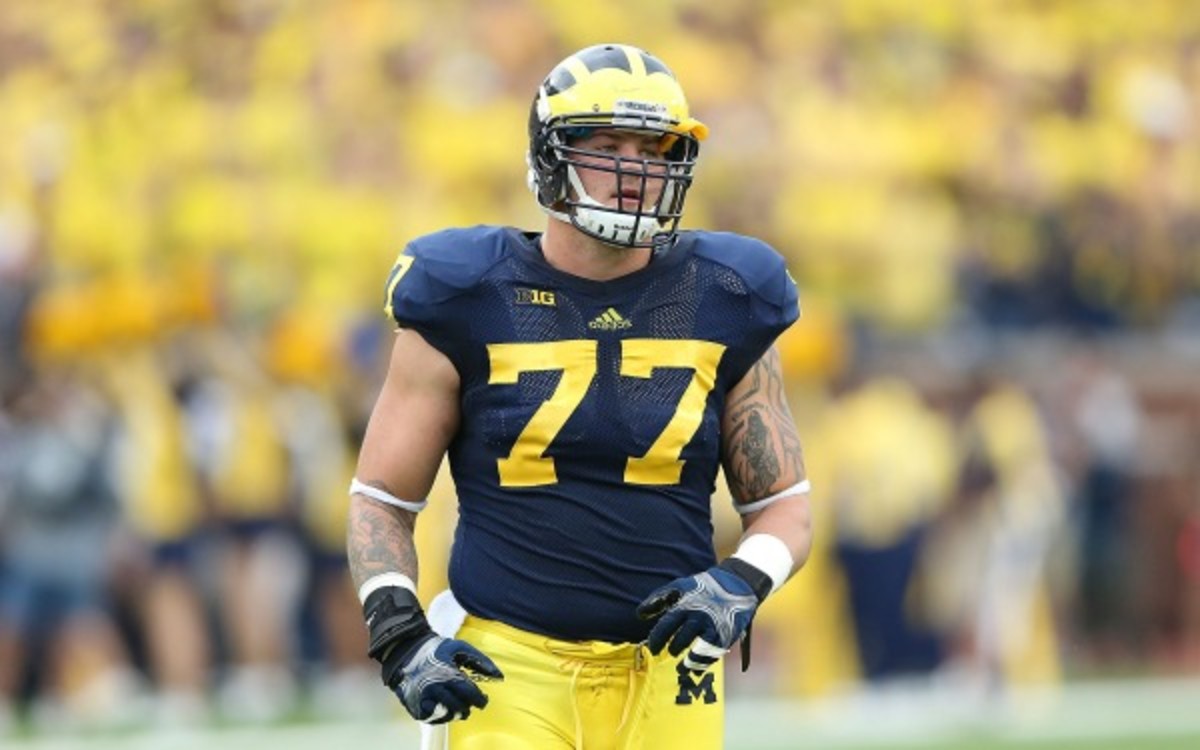 Michigan OT Taylor Lewan denies assault allegations - Sports Illustrated
