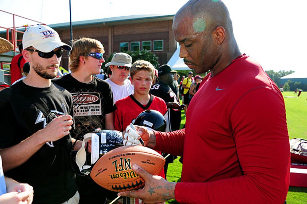 NFL Players with Fans at Training Camp - Sports Illustrated