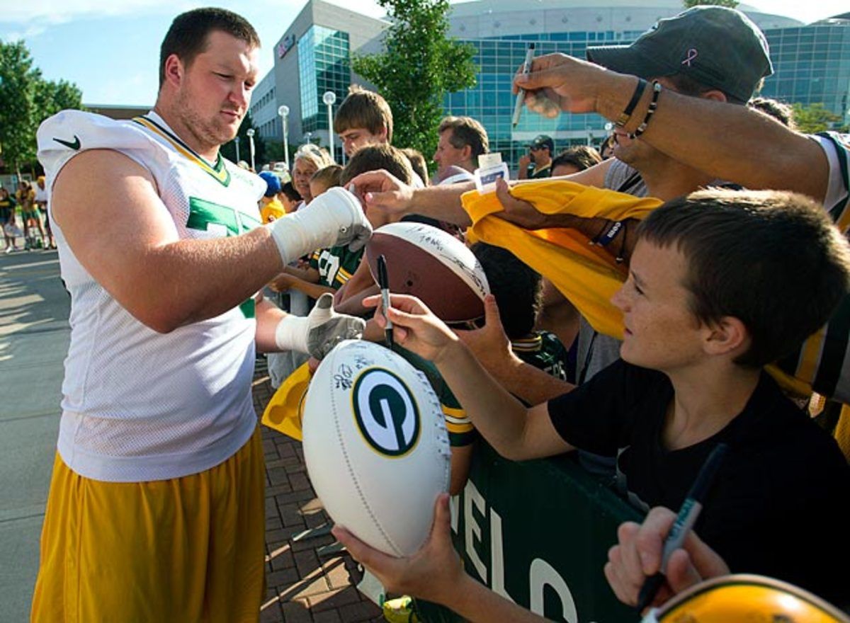 NFL Players with Fans at Training Camp - Sports Illustrated