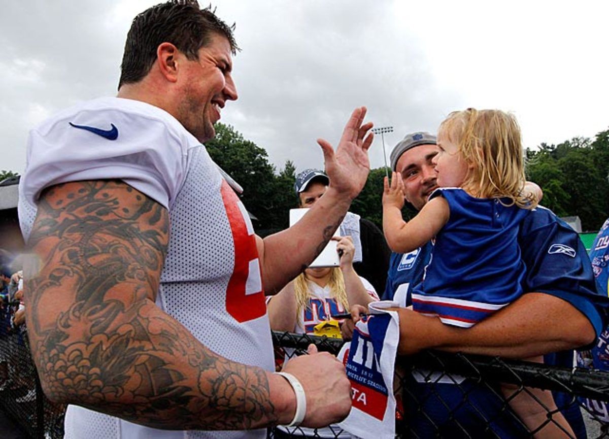 NFL Players with Fans at Training Camp - Sports Illustrated