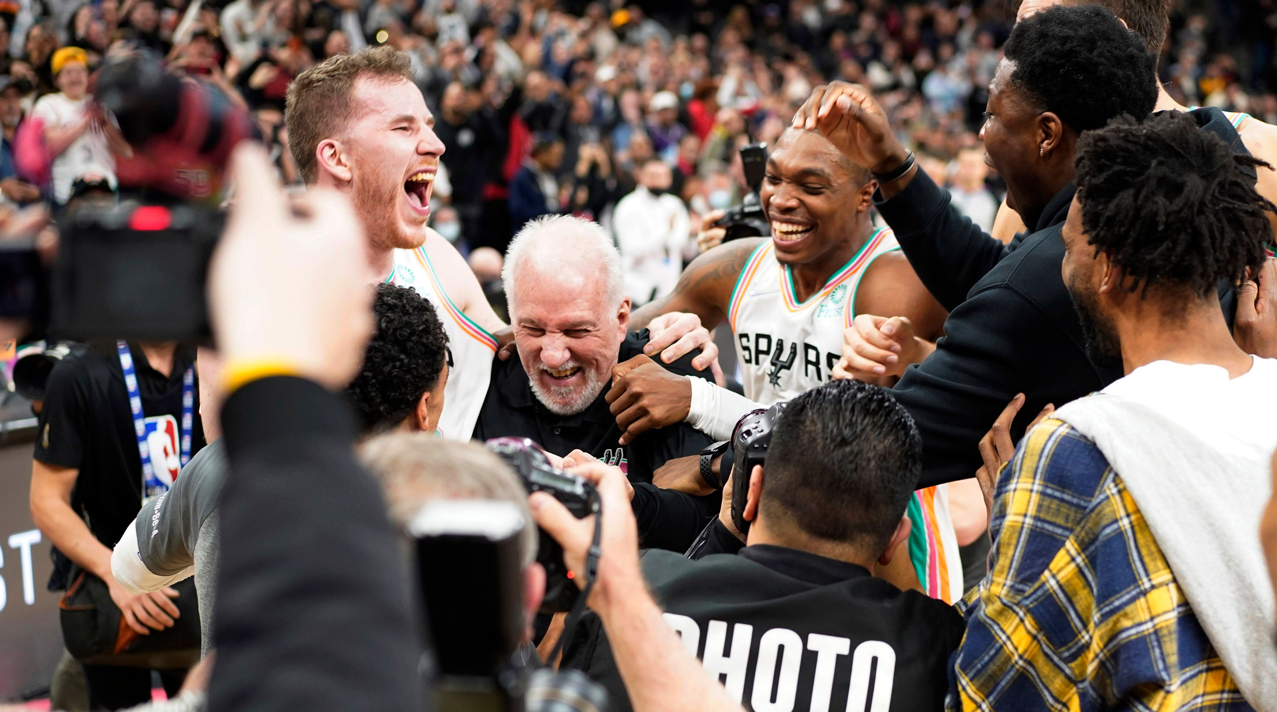 Spurs players mob Gregg Popovich after record-setting victory - Sports ...