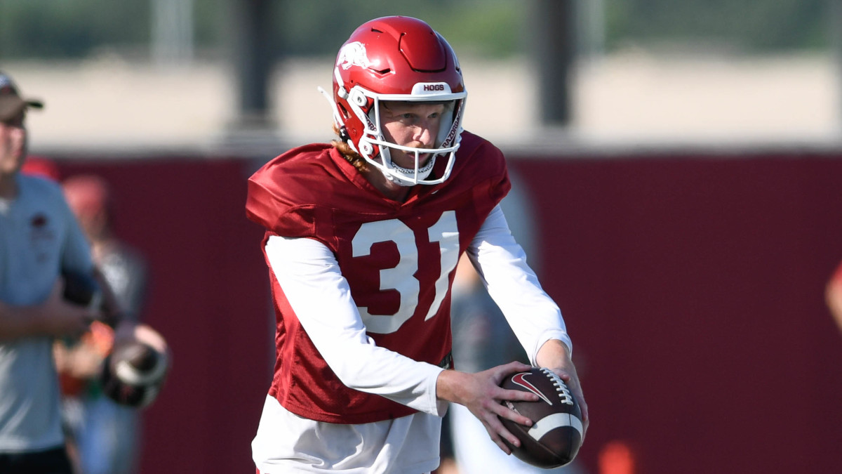 Not knowing Arkansas to Razorback Punting Star, 9000 Miles Away from ...