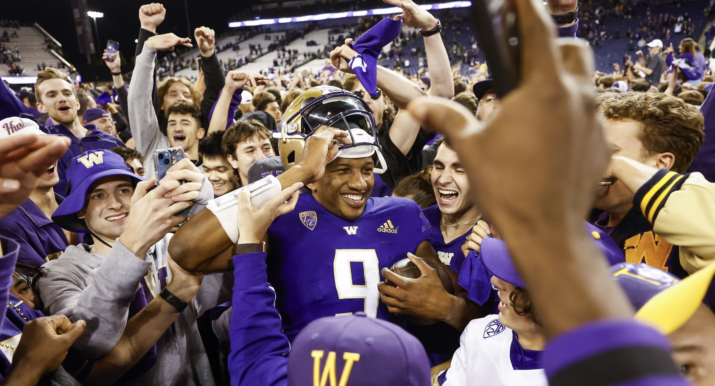 UW Fans Showed Up in Force, Celebrated by Storming the Field - Sports ...